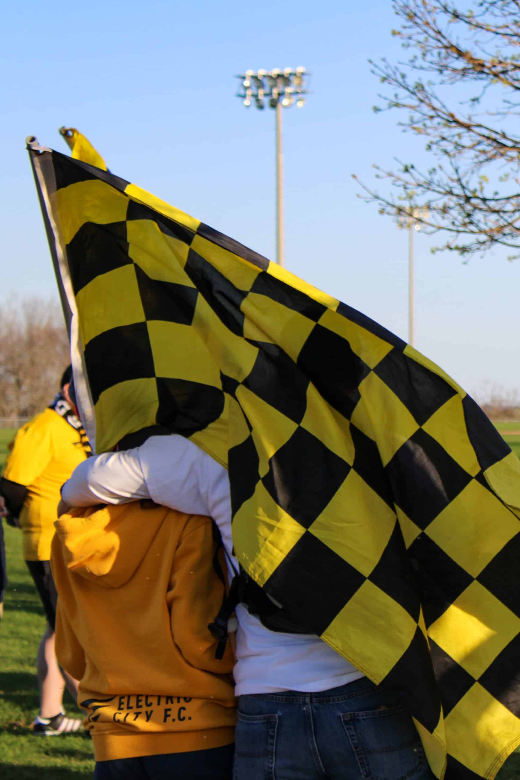Photos: Supporters group cheers on ECFC with flags, smoke and songs ...
